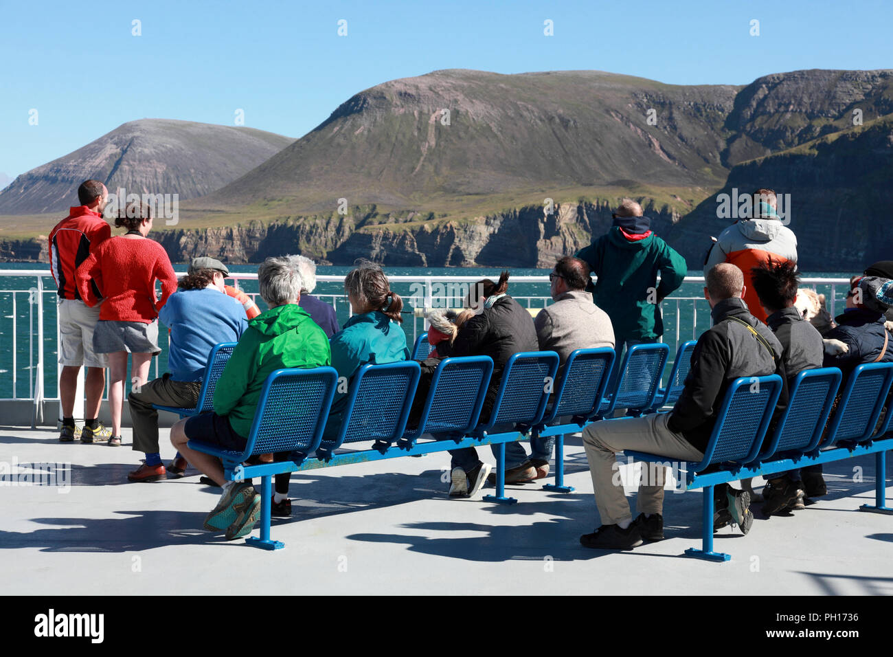 The Northlink ferry MV Hamnavoe passing The Cuilags, on the left, and ...
