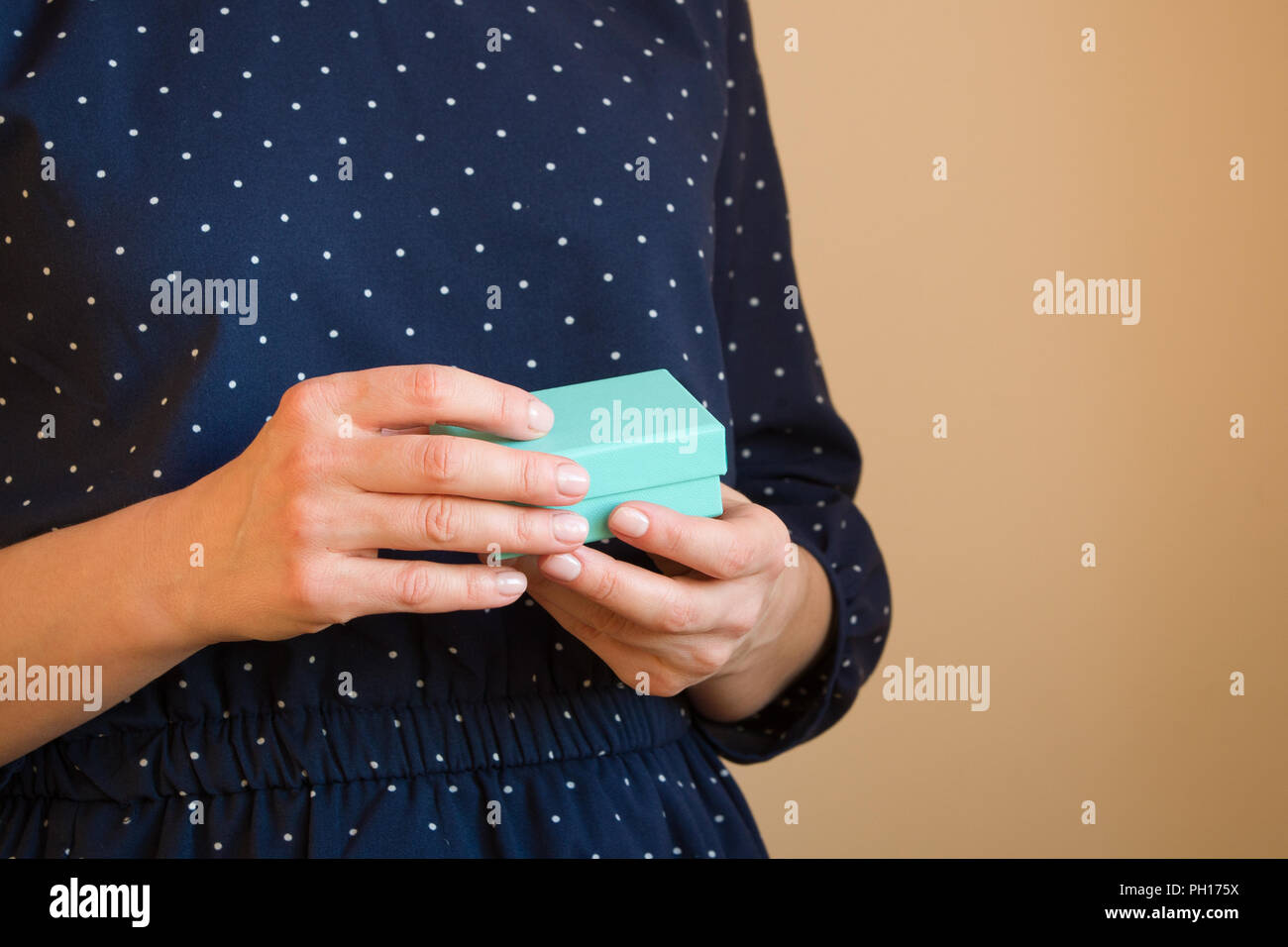 Woman holds small blue gift boxes. Present Stock Photo - Alamy