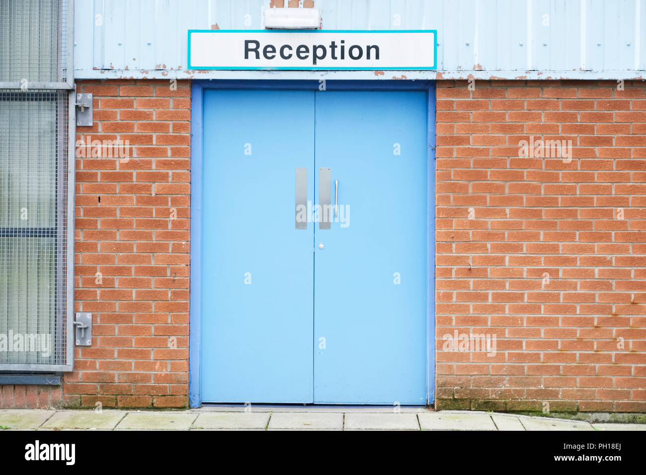 Reception sign above workplace entrance door Stock Photo - Alamy