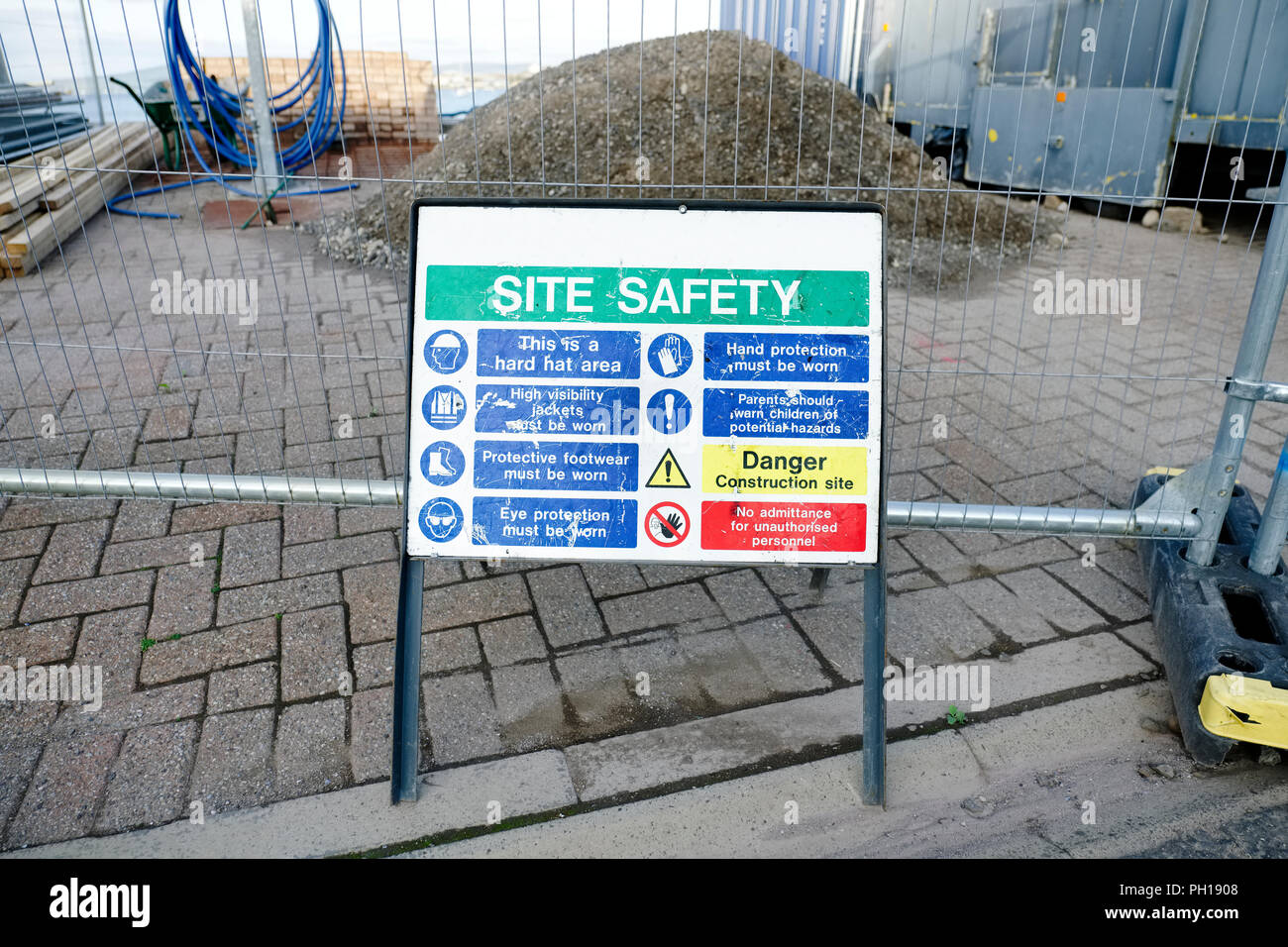 Site safety sign and construction entrance fence Stock Photo - Alamy