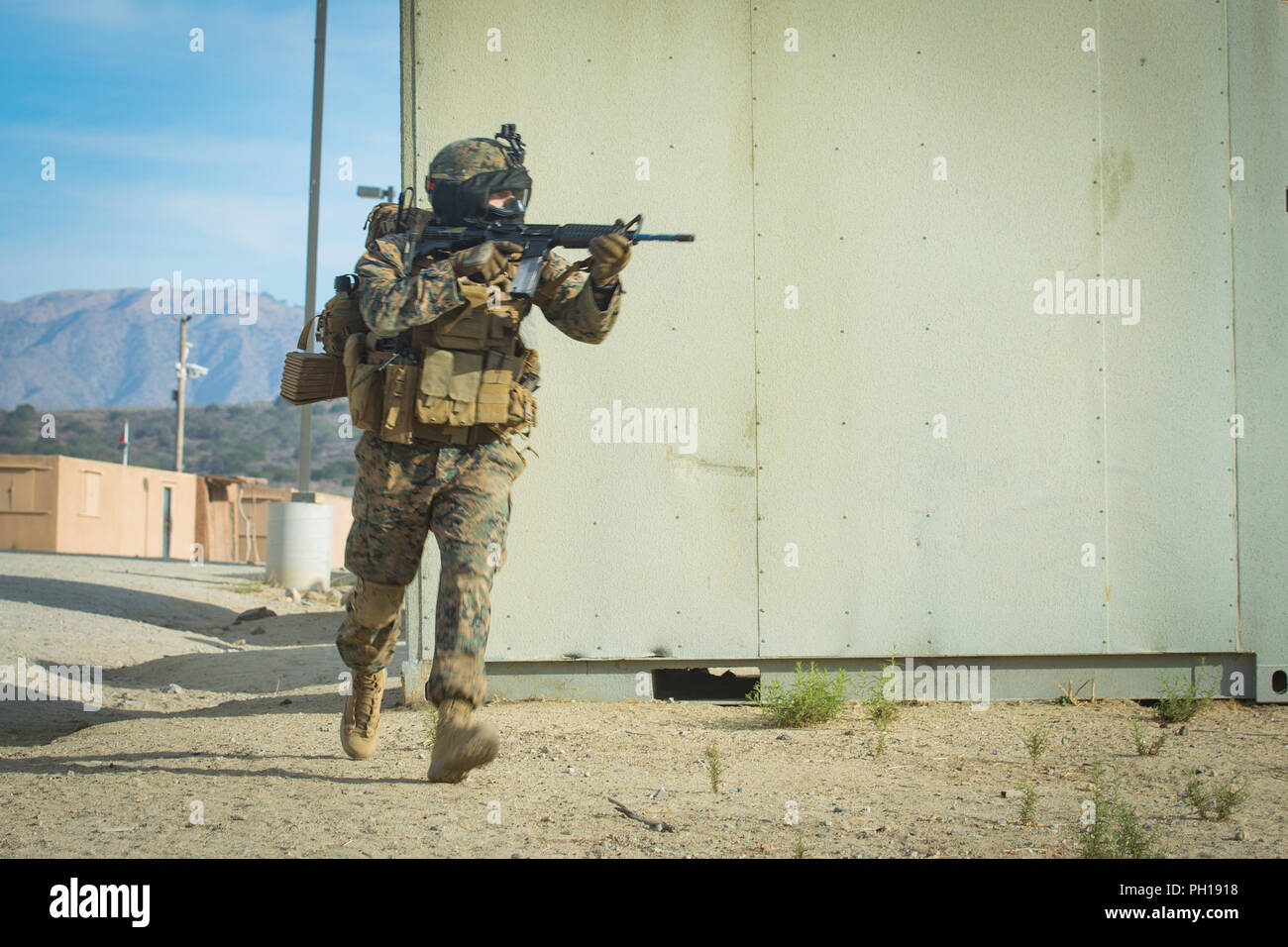 A U.S. Marine with 2nd Battalion, 7th Marine Regiment, runs to advance ...