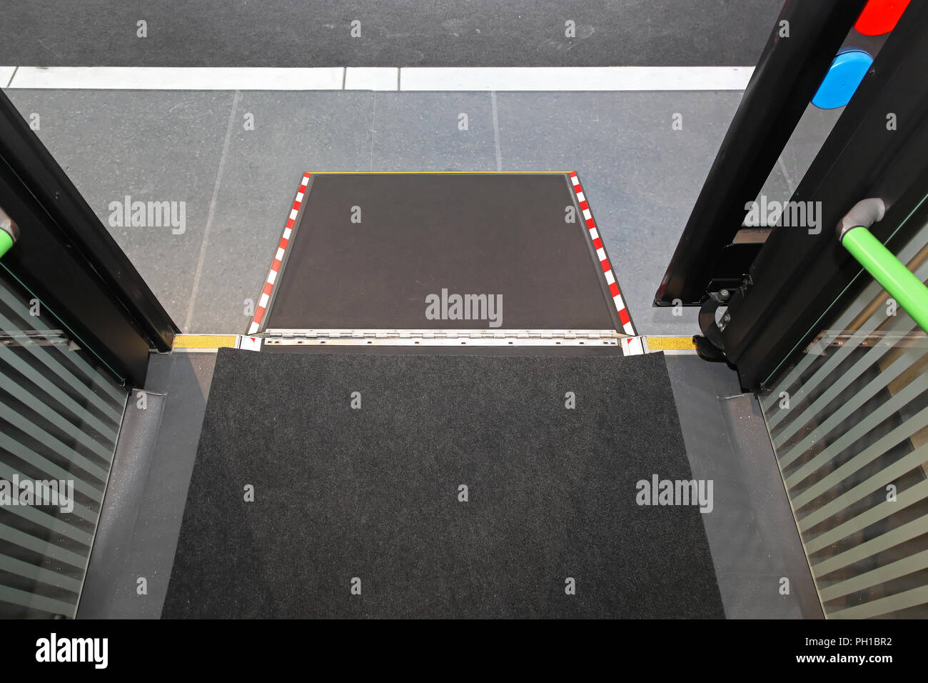 Retractable ramp for wheelchair at city bus Stock Photo - Alamy