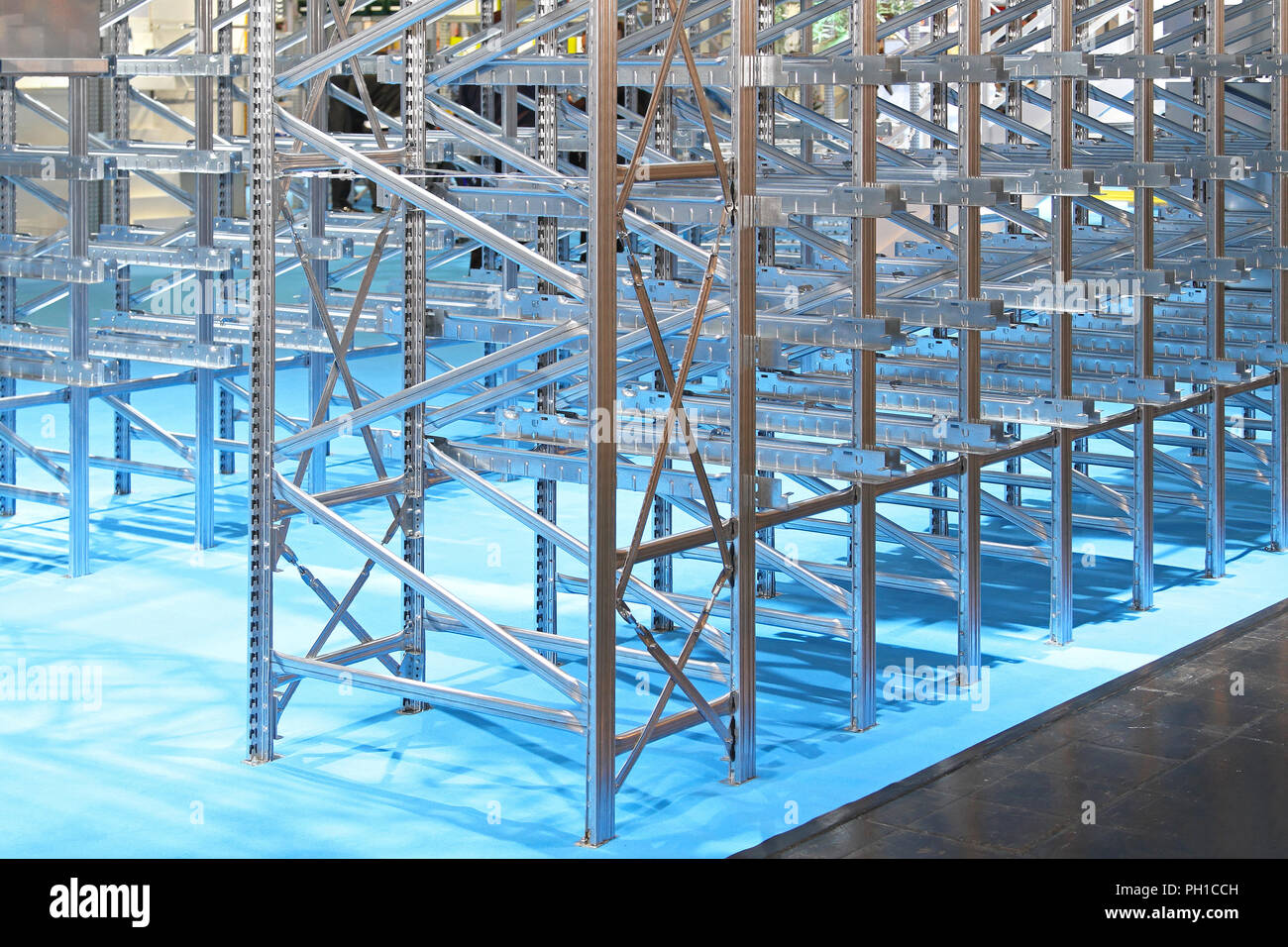 Metal shelving system in new distribution warehouse Stock Photo - Alamy
