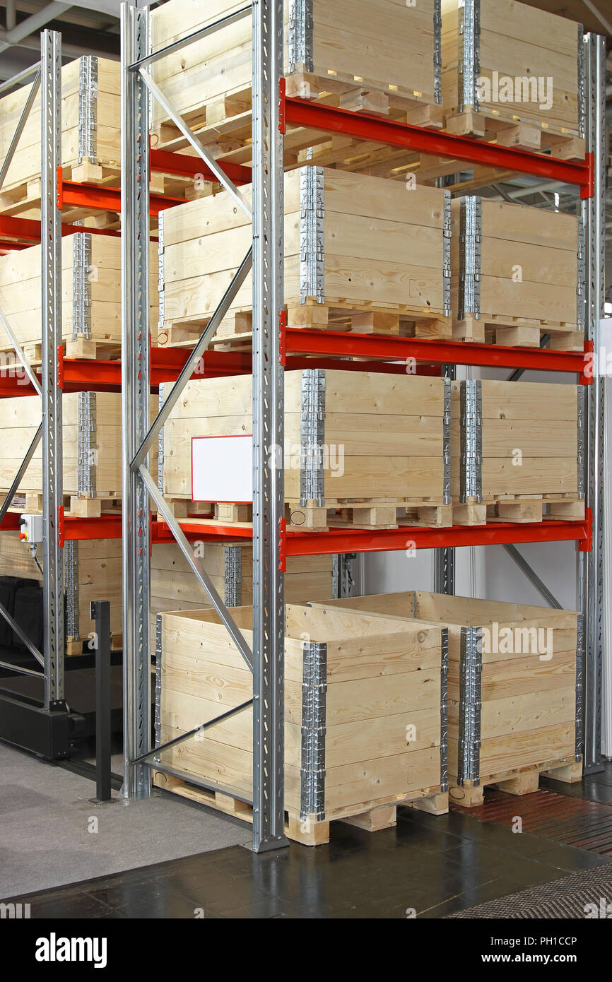 Wooden shipping boxes with pallets in warehouse shelving Stock Photo ...