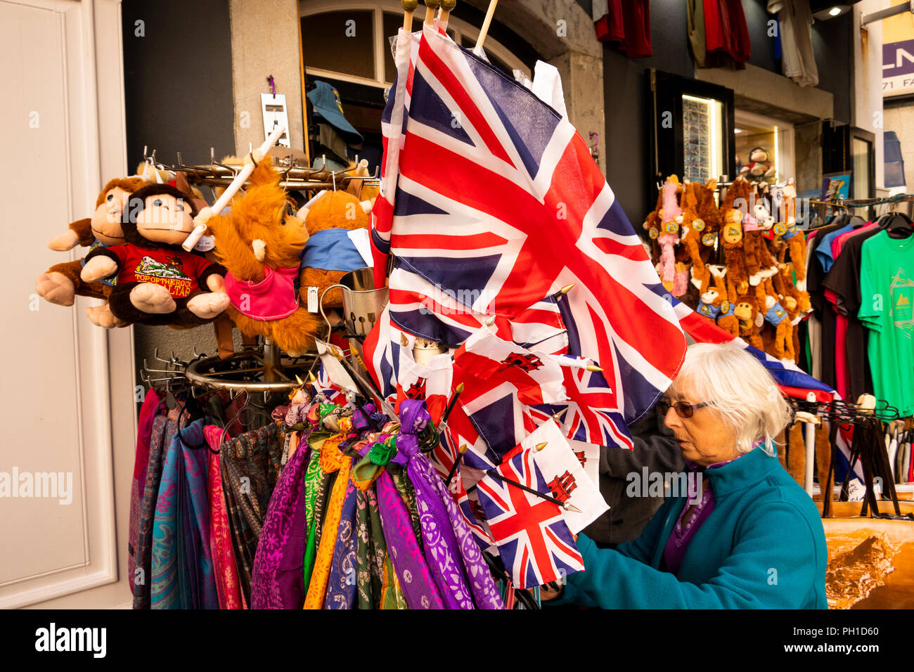 Gibraltar, Main Street, tourist browsing in souvenir shop Stock Photo ...