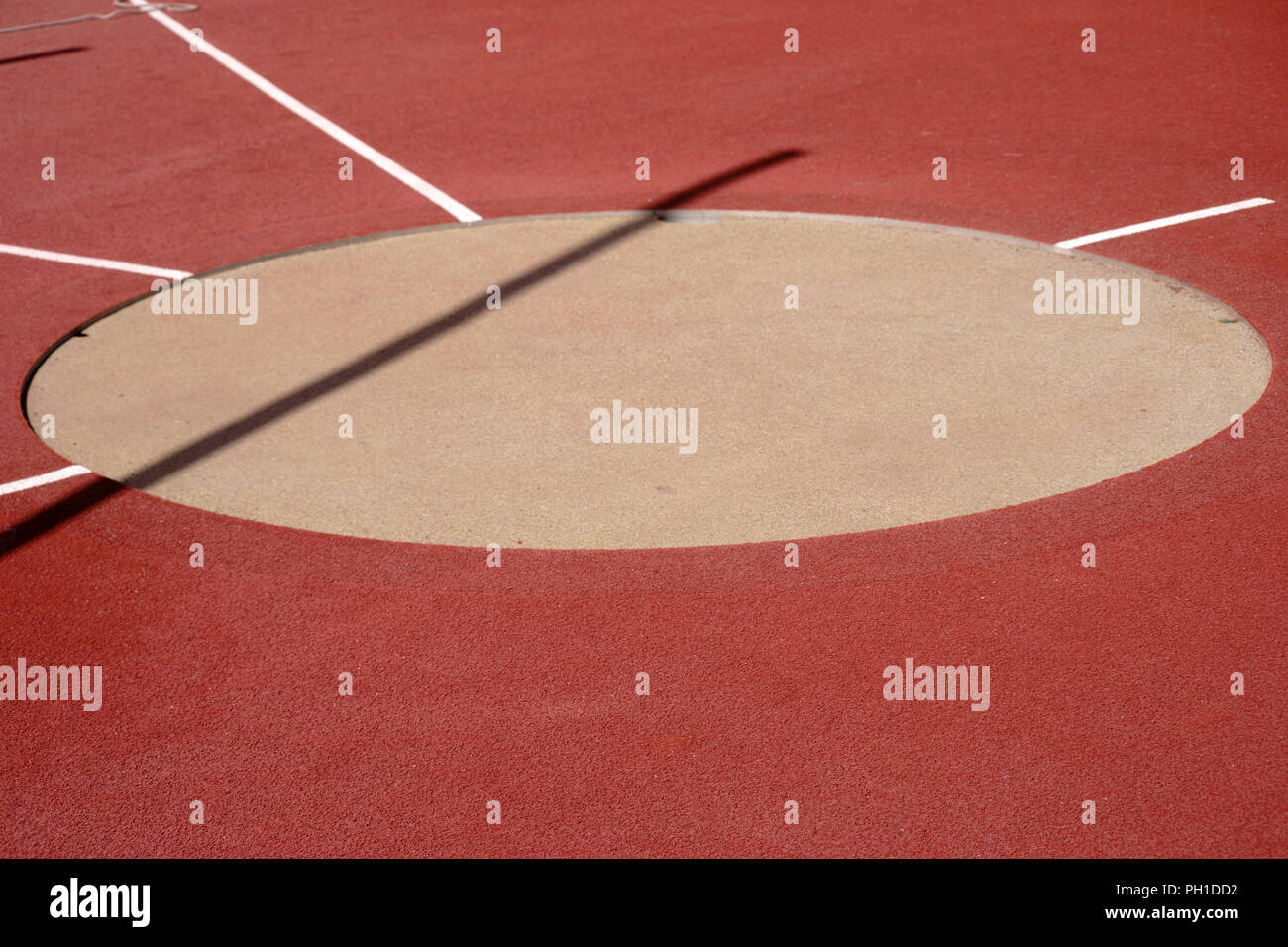The close-up of a discus ring in a stadium with non-slip rubber coating ...