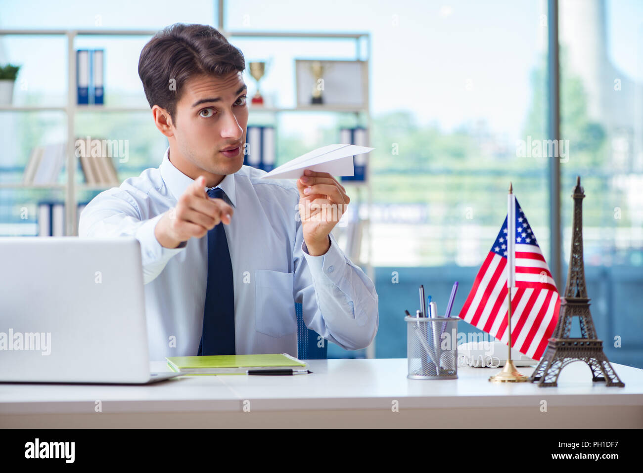 Sales agent working in travel agency Stock Photo - Alamy