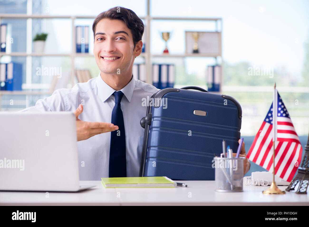 Sales agent working in travel agency Stock Photo - Alamy