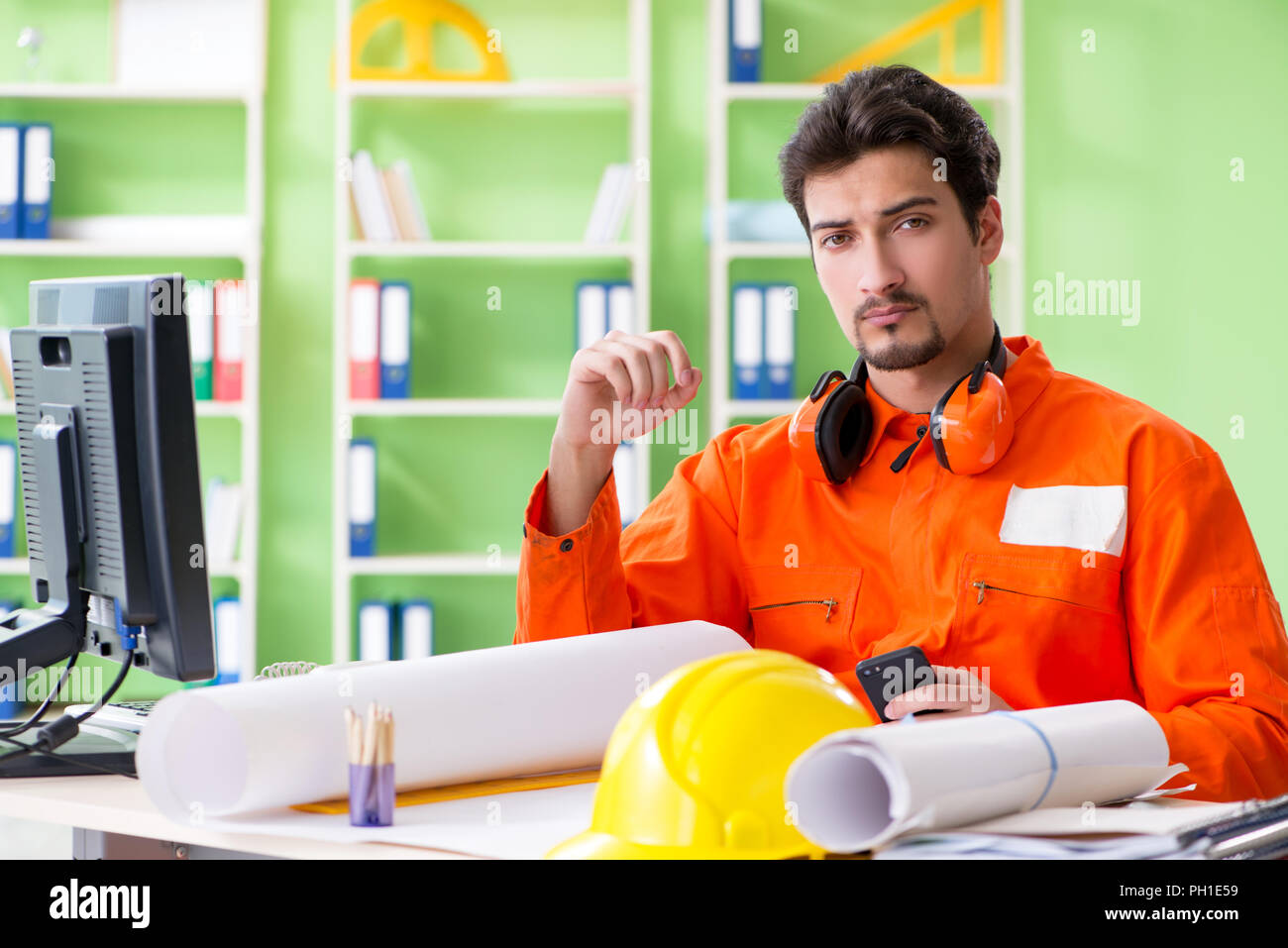 Construction supervisor planning new project in office Stock Photo - Alamy