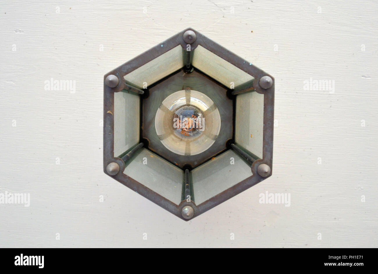 Hexagonal light fixture with one bulb seen from the ground up Stock ...