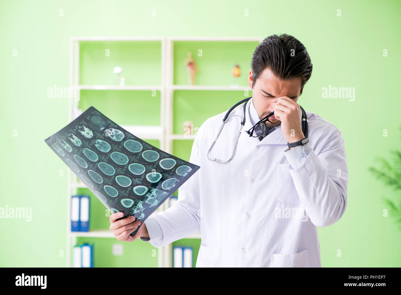 Doctor radiologist looking at x-ray scan in hospital Stock Photo - Alamy