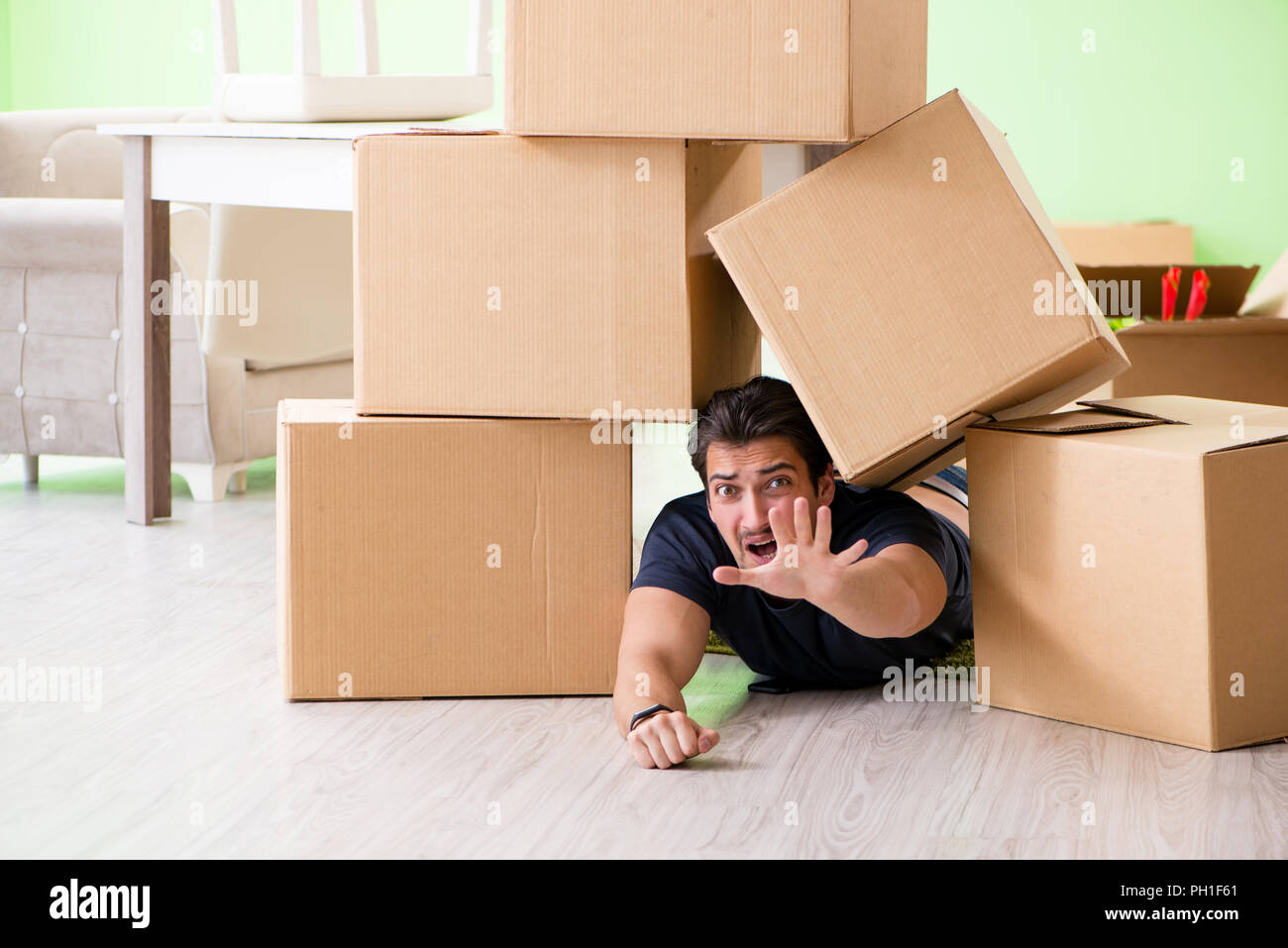 Man moving house with boxes Stock Photo - Alamy