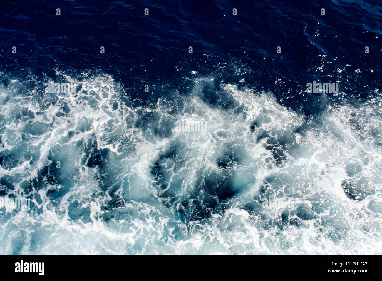 Blue sea waves with a lot of sea foam. Beautiful blue waves with a lot ...