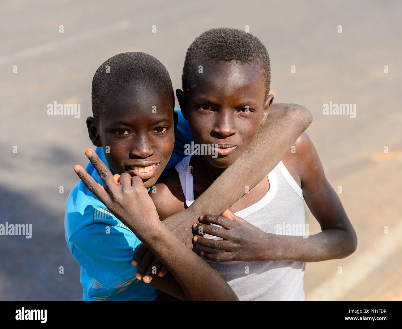 African boys hug hi-res stock photography and images - Alamy