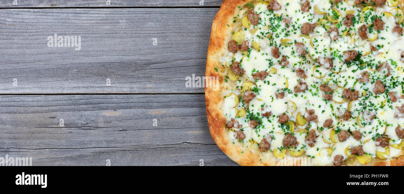 Top view of homemade cooked pizza on rustic wood Stock Photo - Alamy