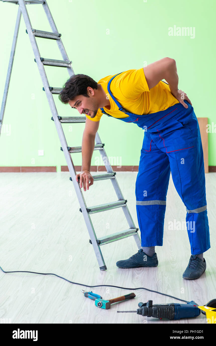 Injured worker at the work site Stock Photo - Alamy