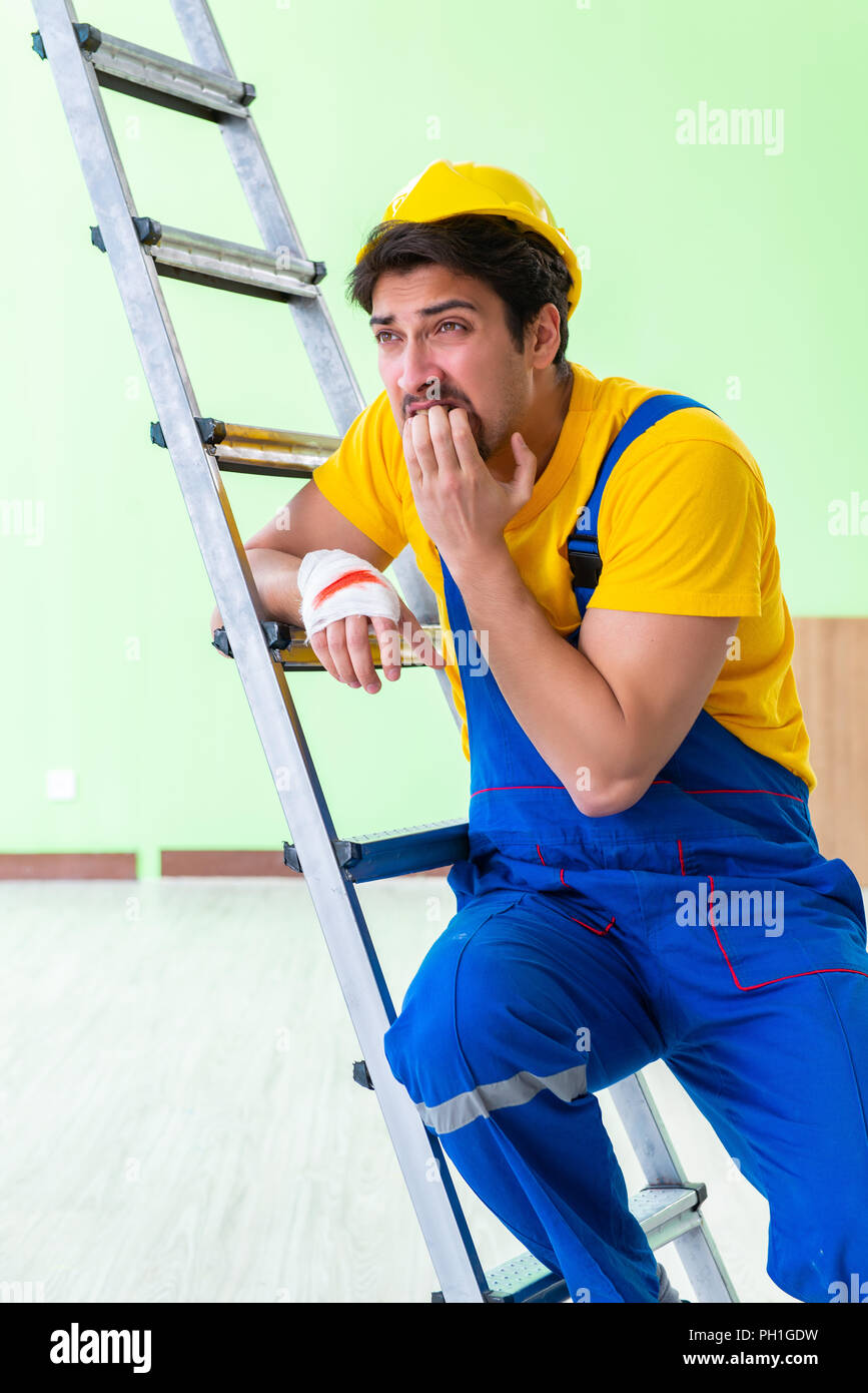 Injured worker at the work site Stock Photo - Alamy