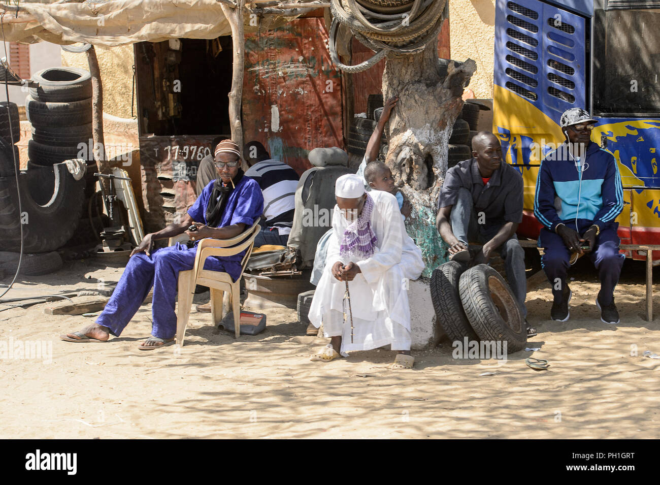 ROAD TO LAMPOUL, SENEGAL - APR 23, 2017: Unidentified Senegalese people ...