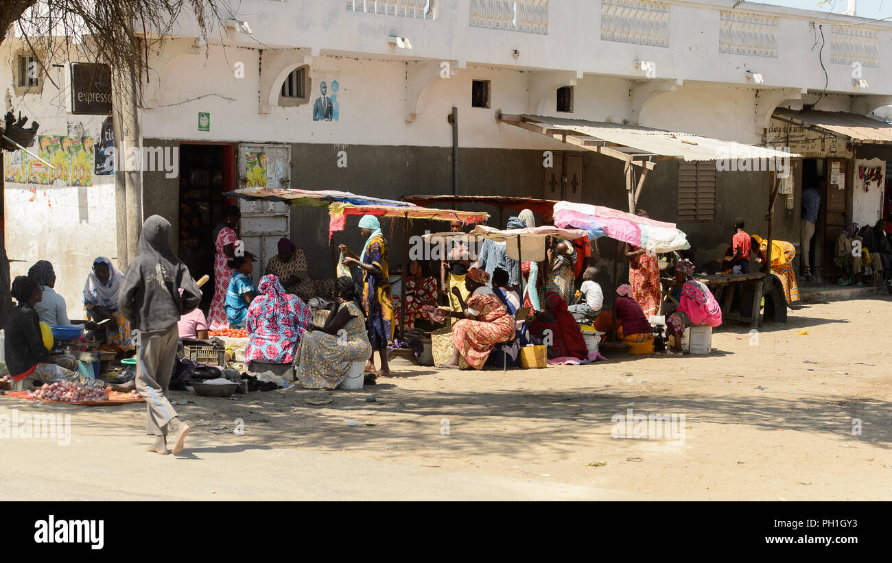 ROAD TO LAMPOUL, SENEGAL - APR 23, 2017: Unidentified Senegalese people ...