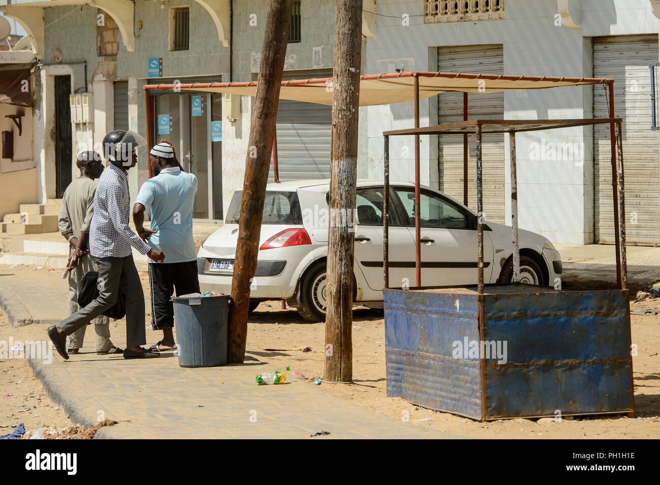 ROAD TO LAMPOUL, SENEGAL - APR 23, 2017: Unidentified Senegalese people ...