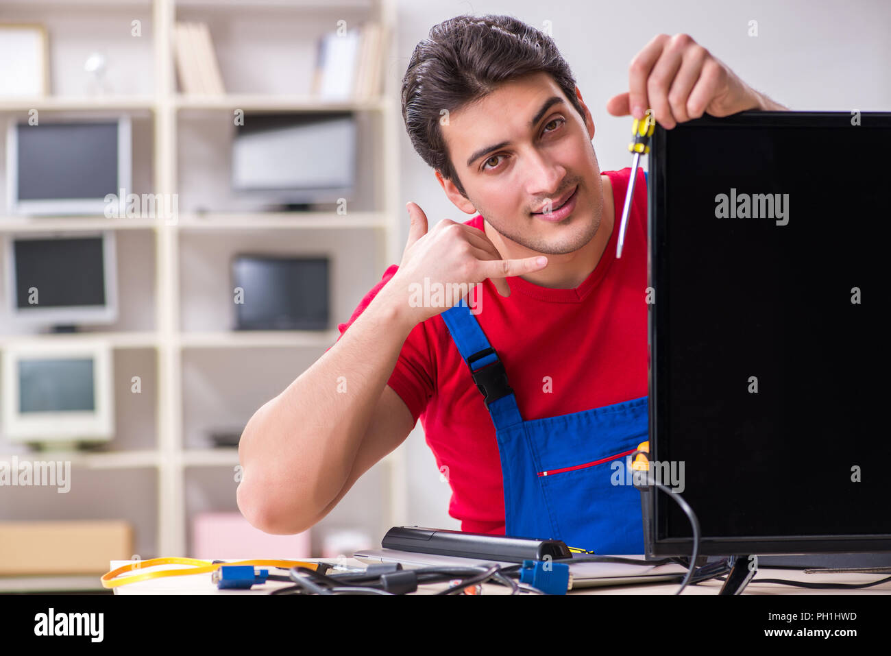 Professional repair engineer repairing broken tv Stock Photo - Alamy