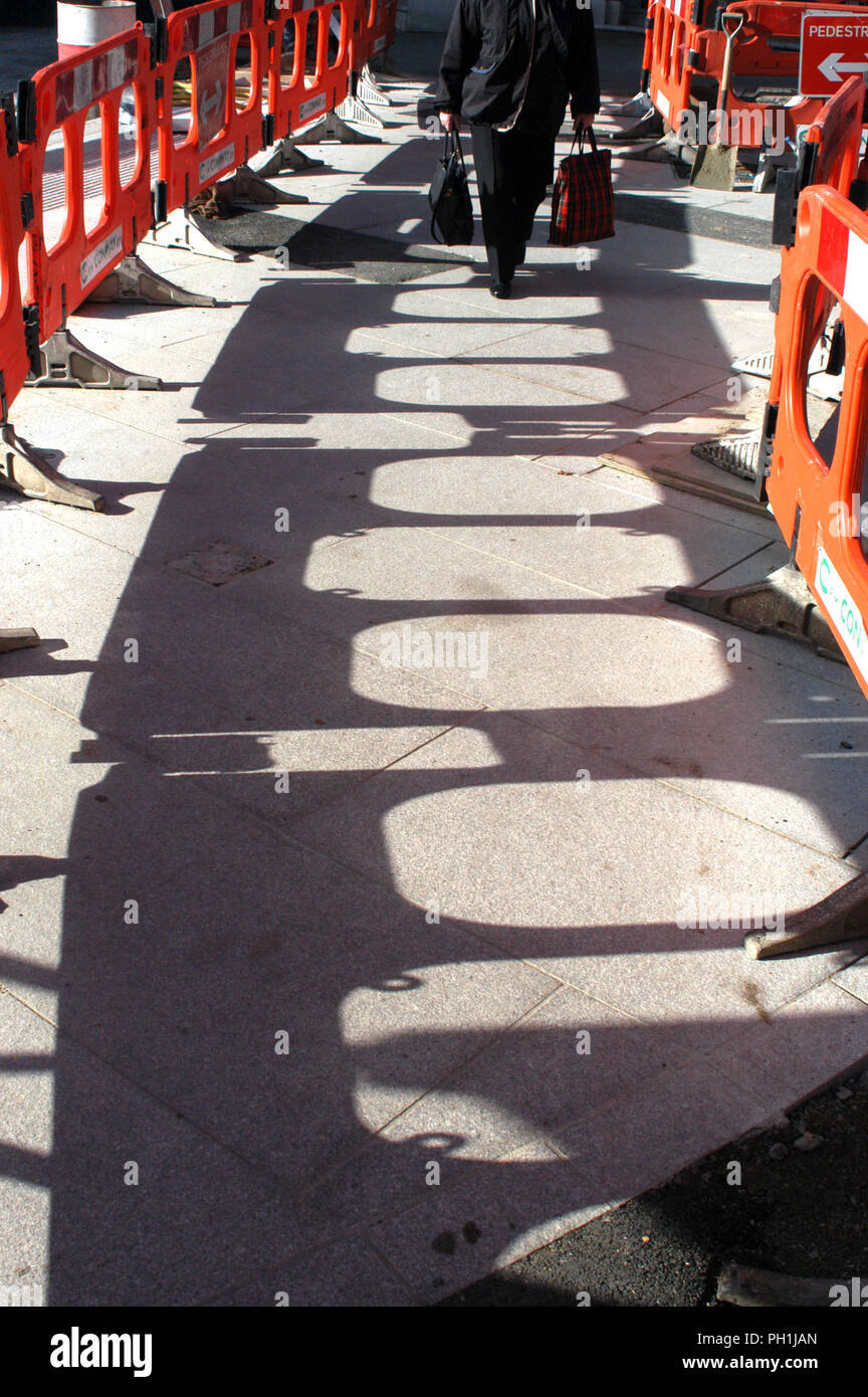 People are forced to slow down and walk inside the safety barriers due ...