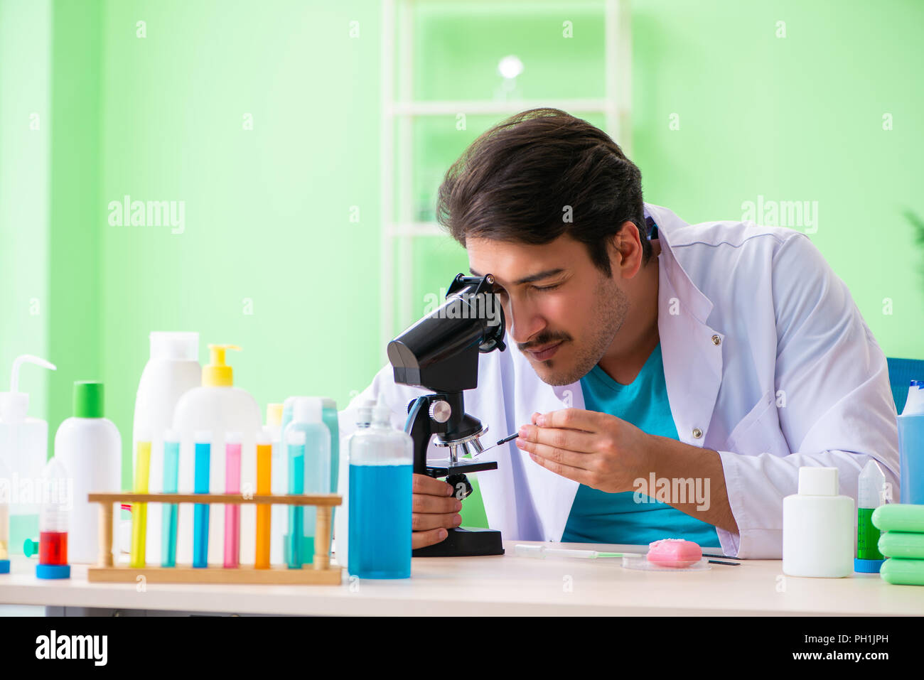 Chemist testing soap in the lab Stock Photo - Alamy