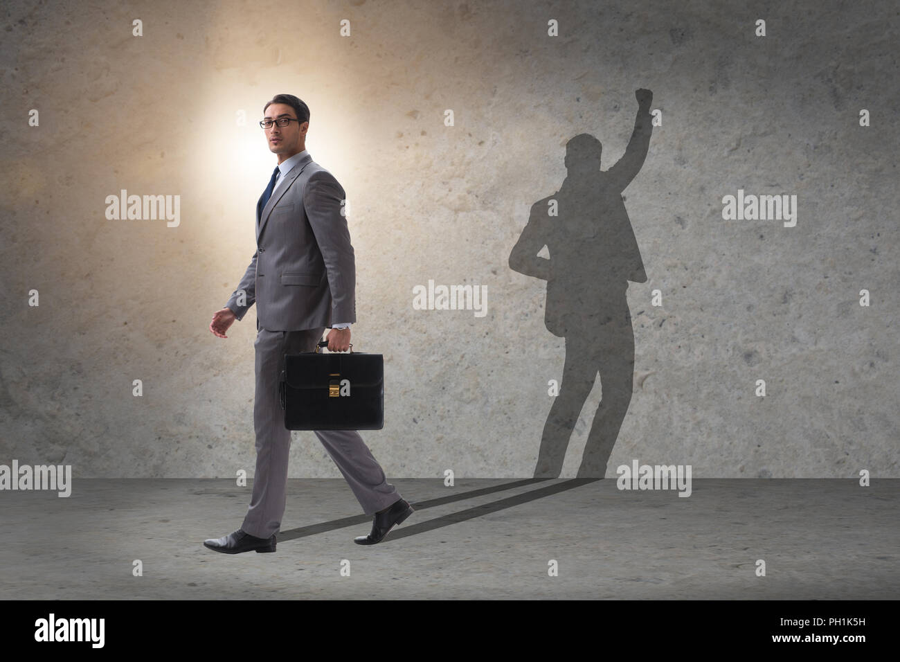Businessman and his shadow in business concept Stock Photo - Alamy
