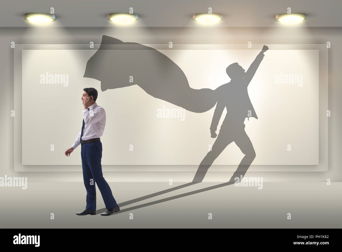 Businessman and his shadow in business concept Stock Photo - Alamy