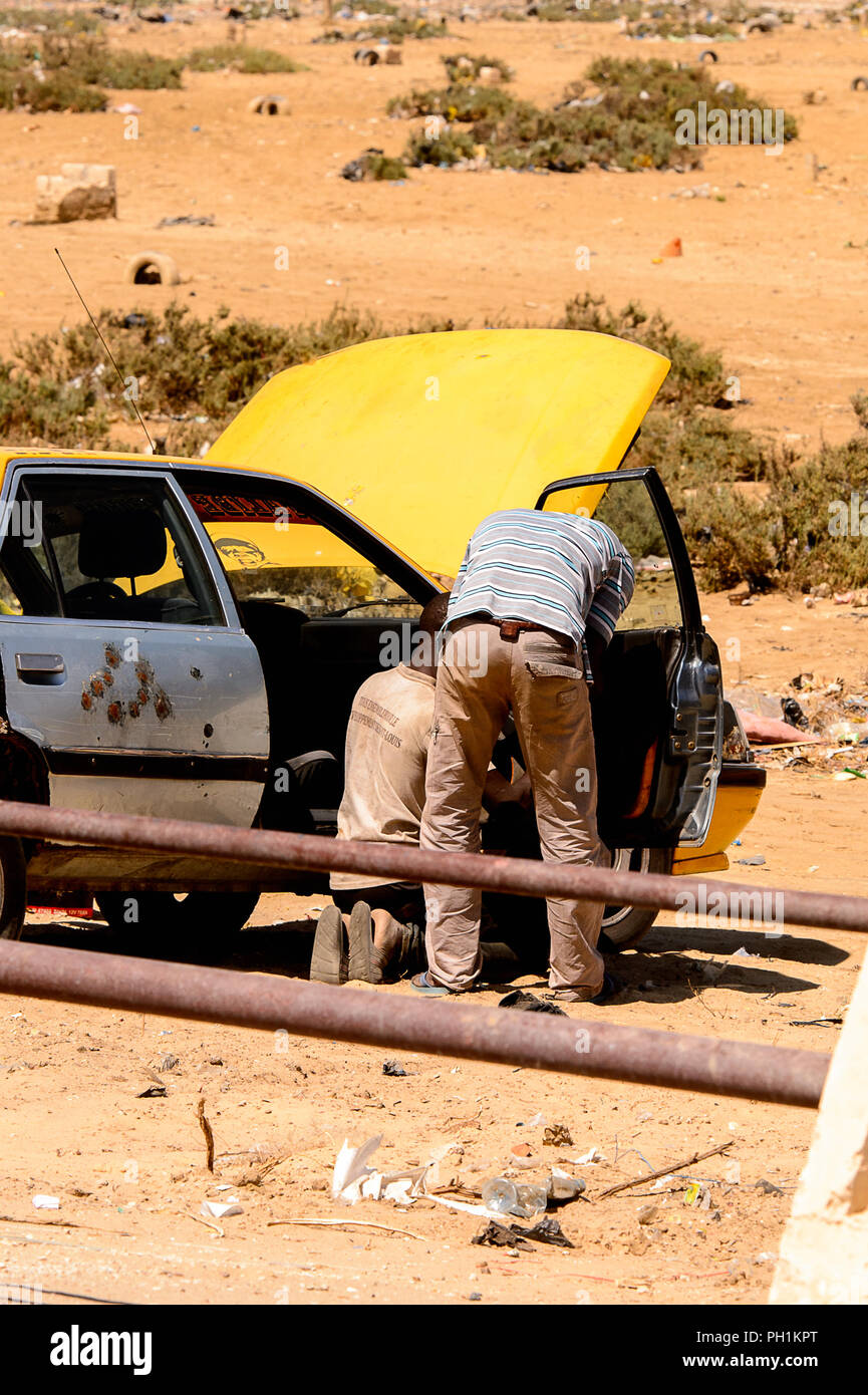 ROAD TO LAMPOUL, SENEGAL - APR 23, 2017: Unidentified Senegalese two ...