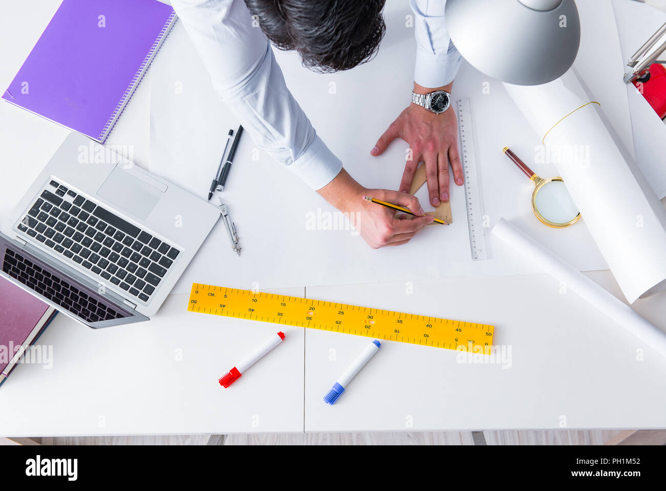 Engineer working on new project drawings Stock Photo - Alamy
