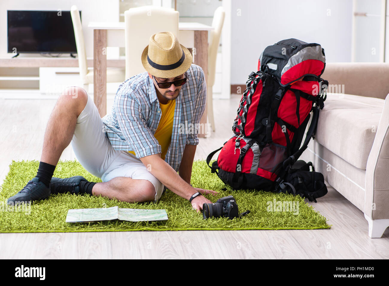 Man planning his travel with map Stock Photo - Alamy