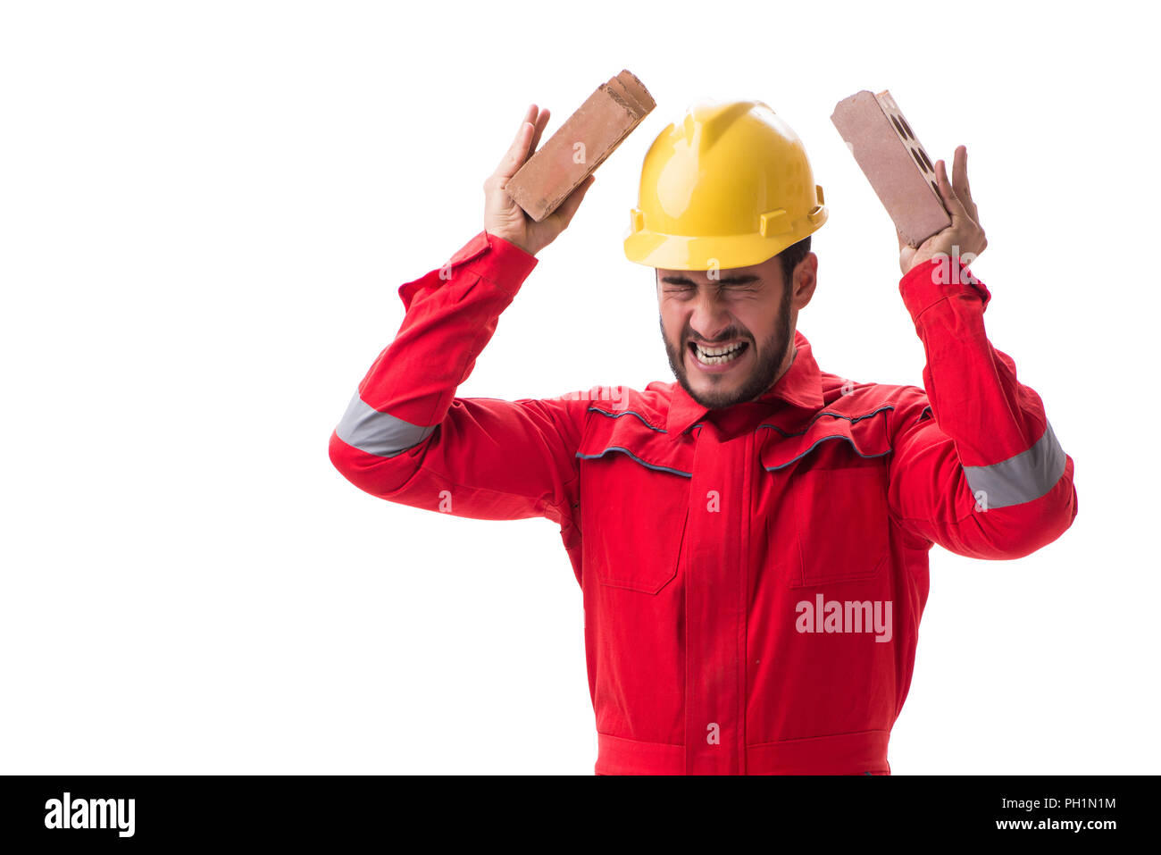 Angry builder breaking bricks isolated on white Stock Photo - Alamy