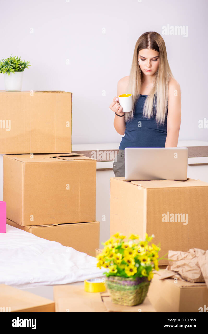 Young woman moving to new place Stock Photo - Alamy