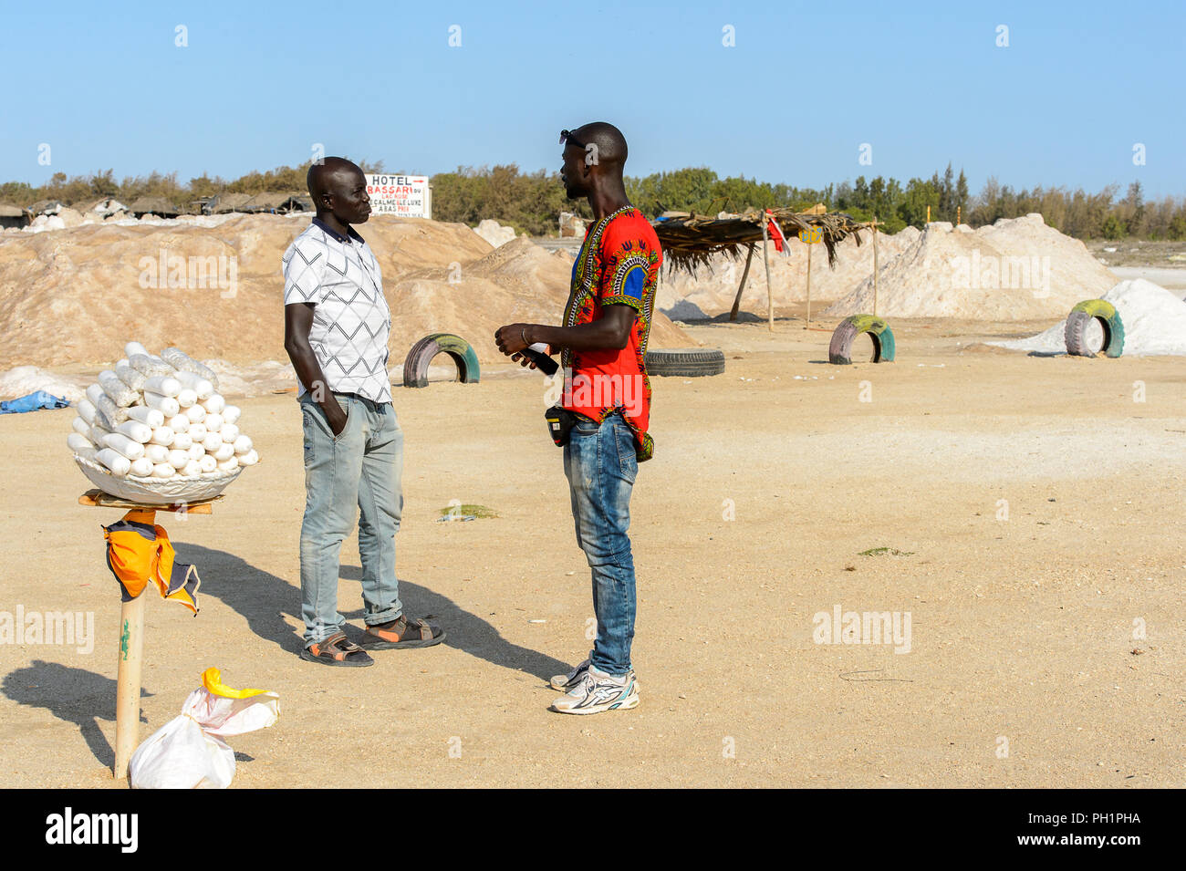 LAC ROSE, SENEGAL - APR 26, 2017: Unidentified Senegalese two men talk ...
