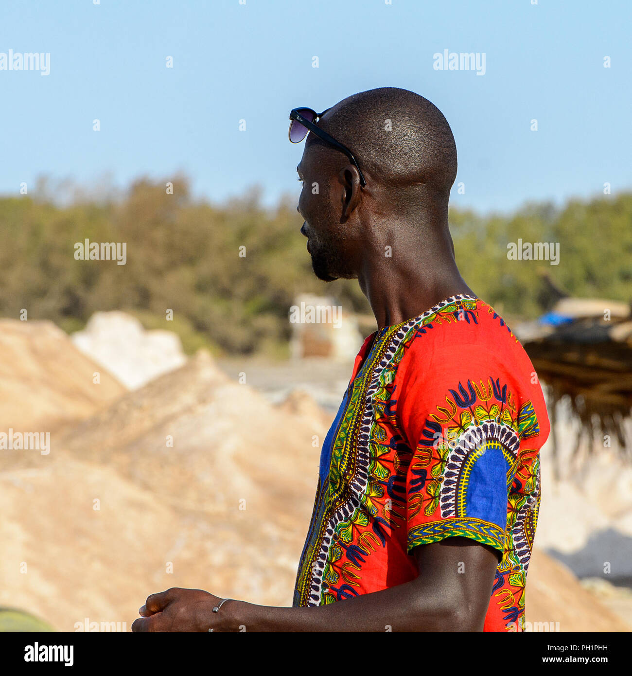 LAC ROSE, SENEGAL - APR 26, 2017: Unidentified Senegalese man stands on ...