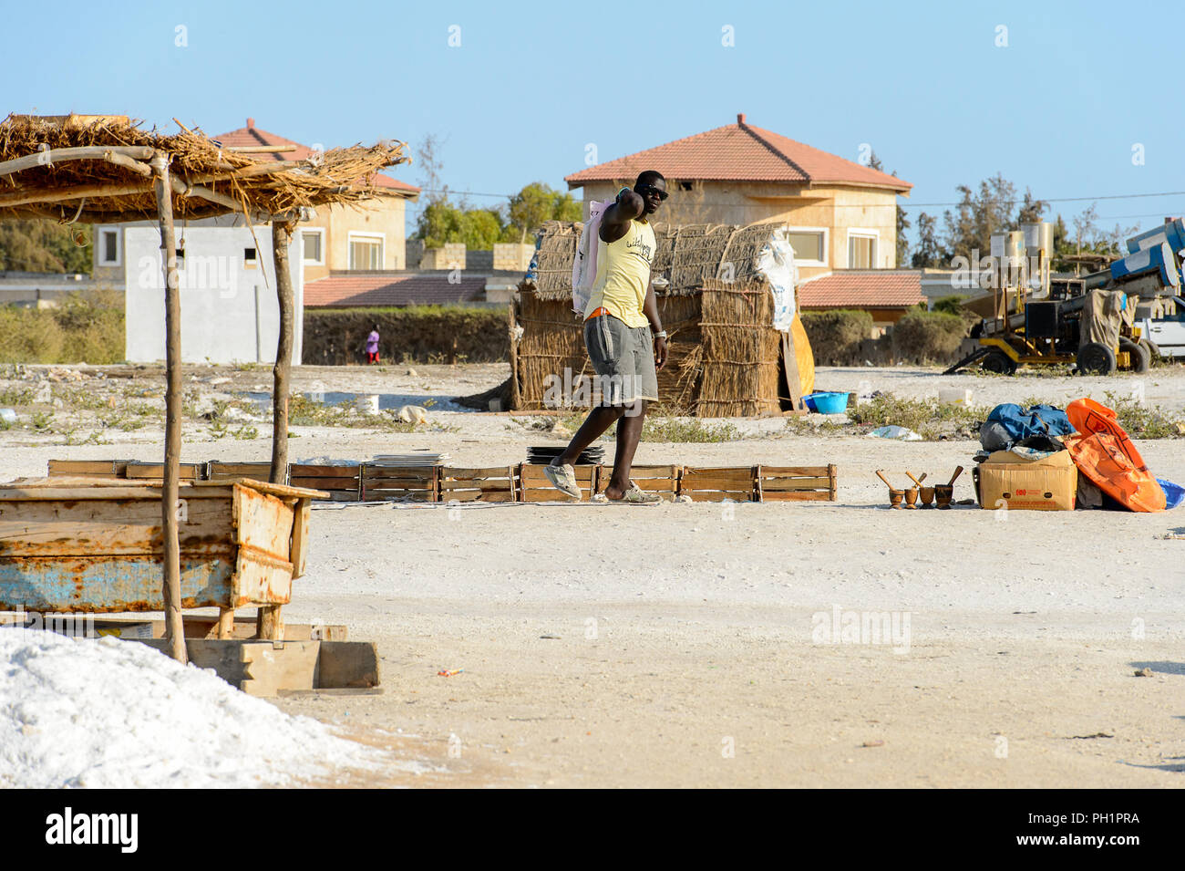 LAC ROSE, SENEGAL - APR 26, 2017: Unidentified Senegalese man carries ...