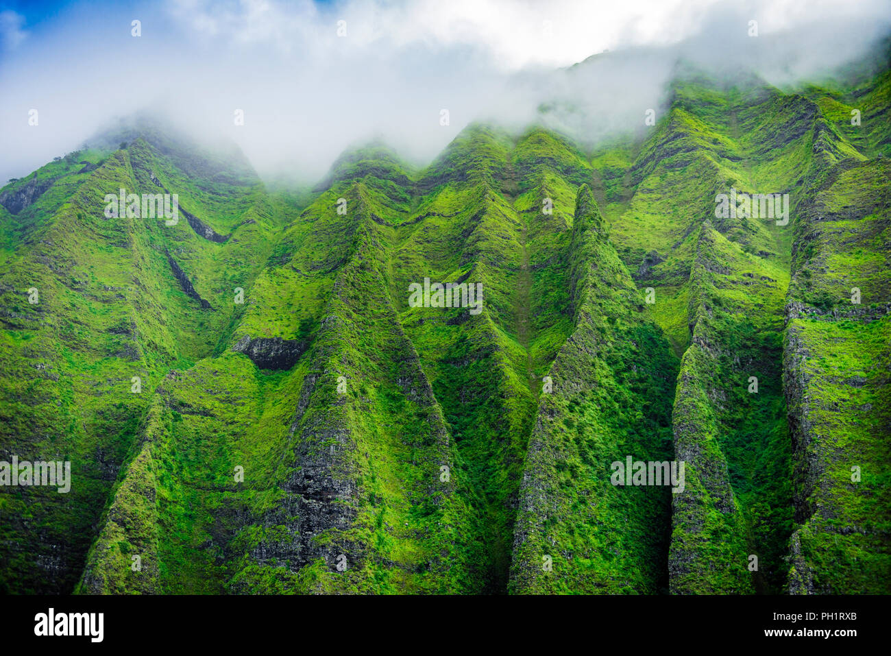 Lush canyon walls in Honopu Valley on the Na Pali Coast (aerial ...