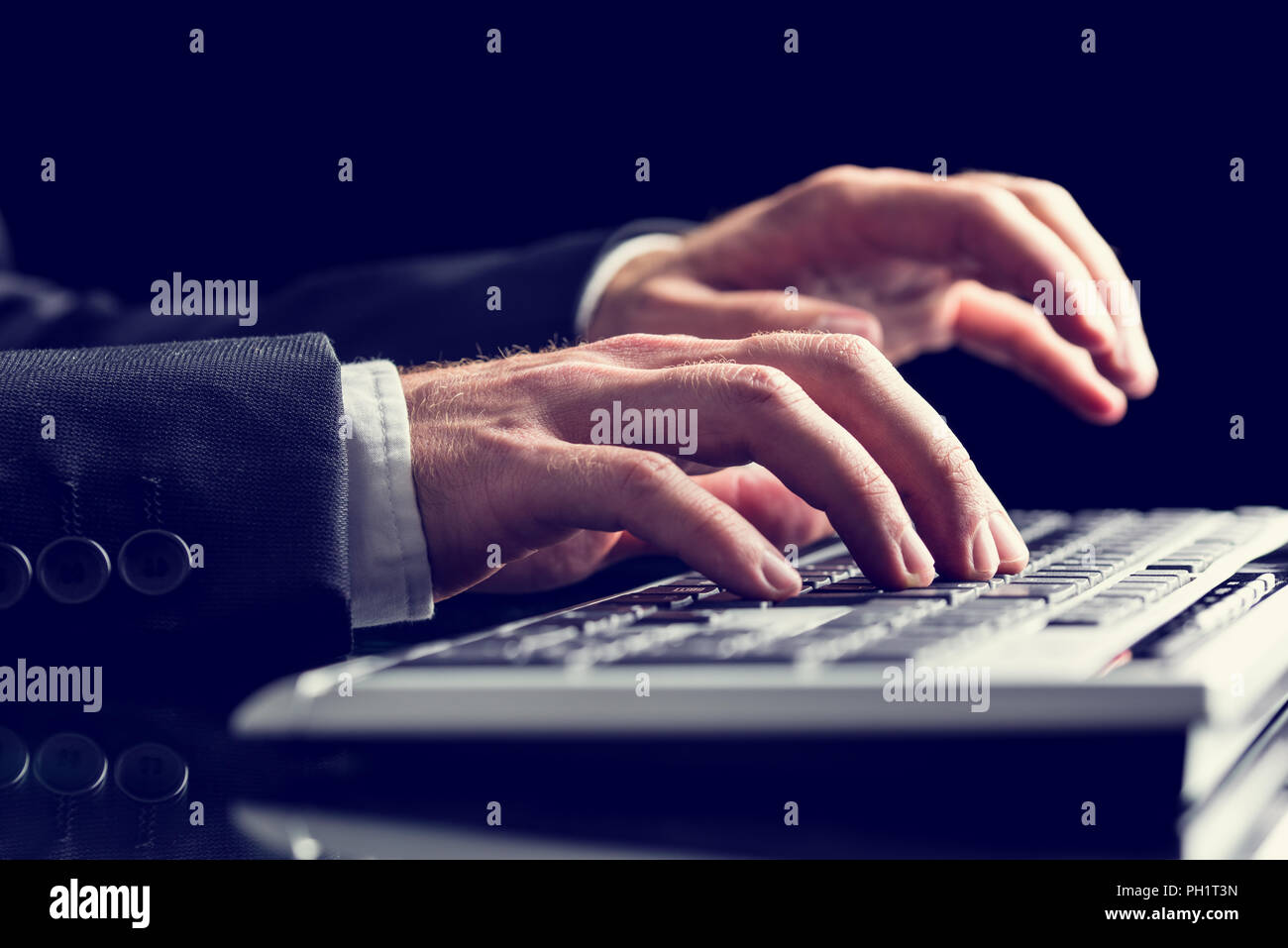 Retro image of businessman hands using office computer keyboard. Over black background Stock ...