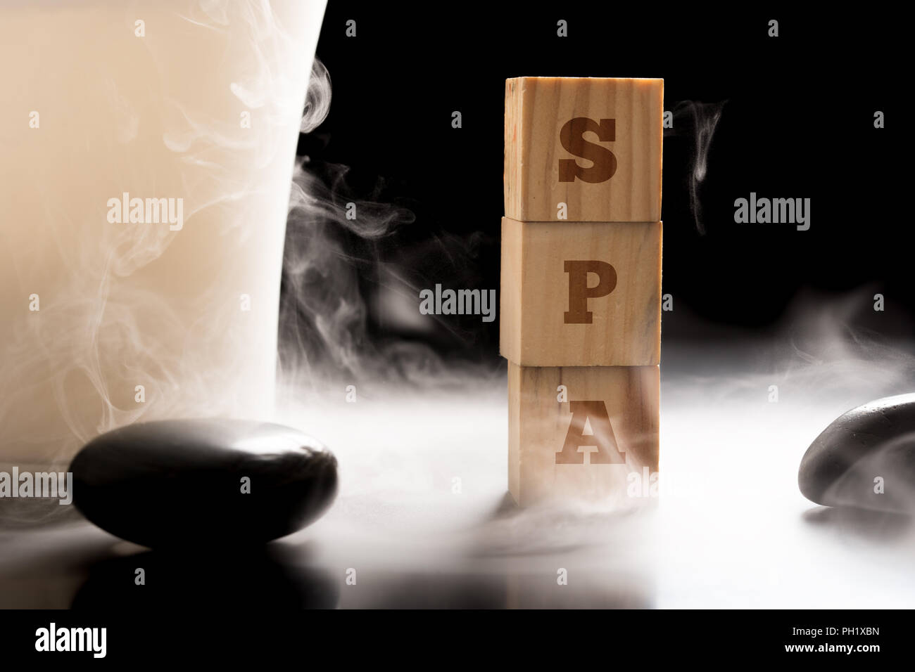 Spa concept with the word spa in alphabet letters on stacked wooden ...