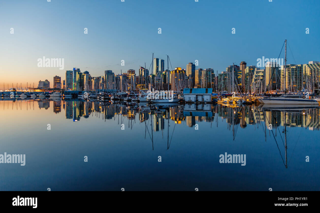 The skyline of Vancouver seen early in the morning from Stanley Park ...
