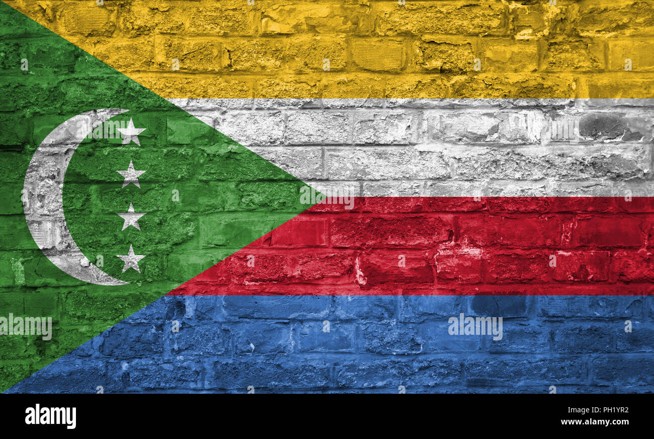 Flag of Comoros over an old brick wall background, surface Stock Photo ...