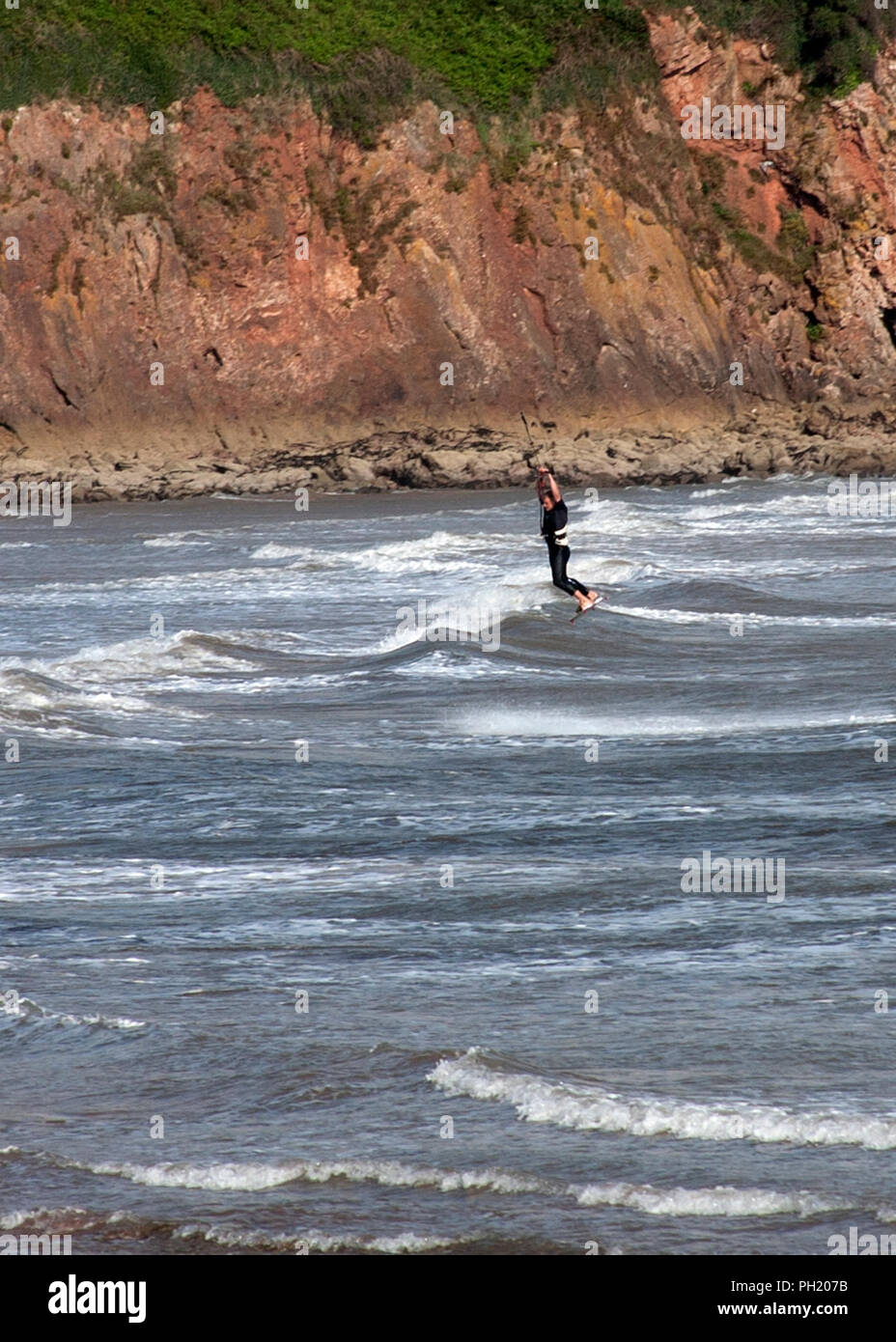 Wind surfer near Long Quarry Point Torquay UK Stock Photo - Alamy