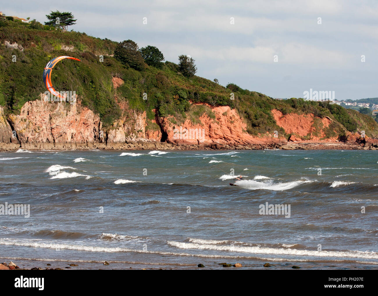 Wind surfer near Long Quarry Point Torquay UK Stock Photo - Alamy