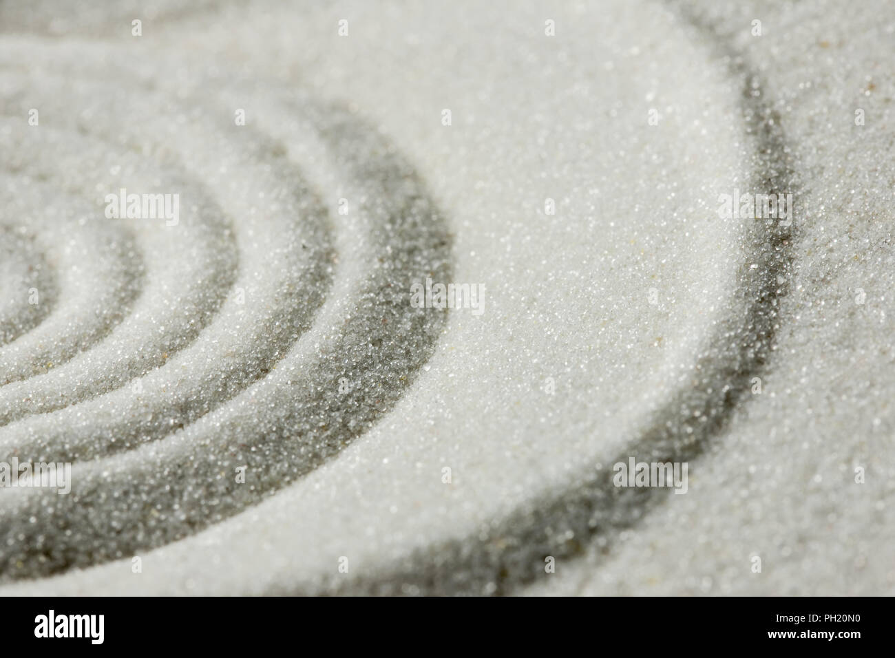 Raked sand background pattern and texture in a Japanese zen garden with ...