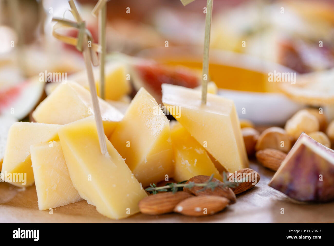 Light Italian snacks. A buffet table at a dinner party. Cheese plate ...