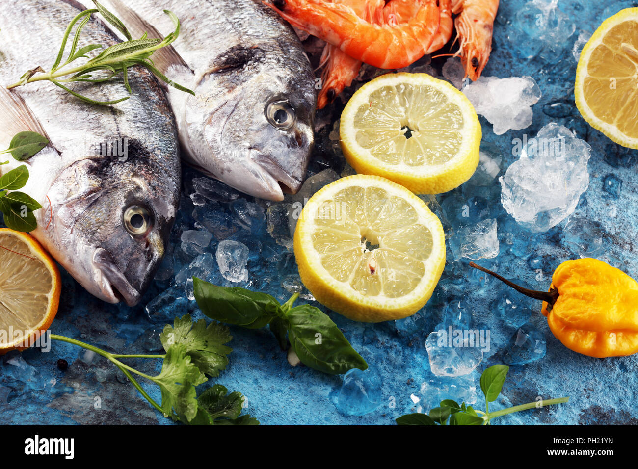 Delicious fresh fish. Fish with aromatic herbs, spices and vegetables ...
