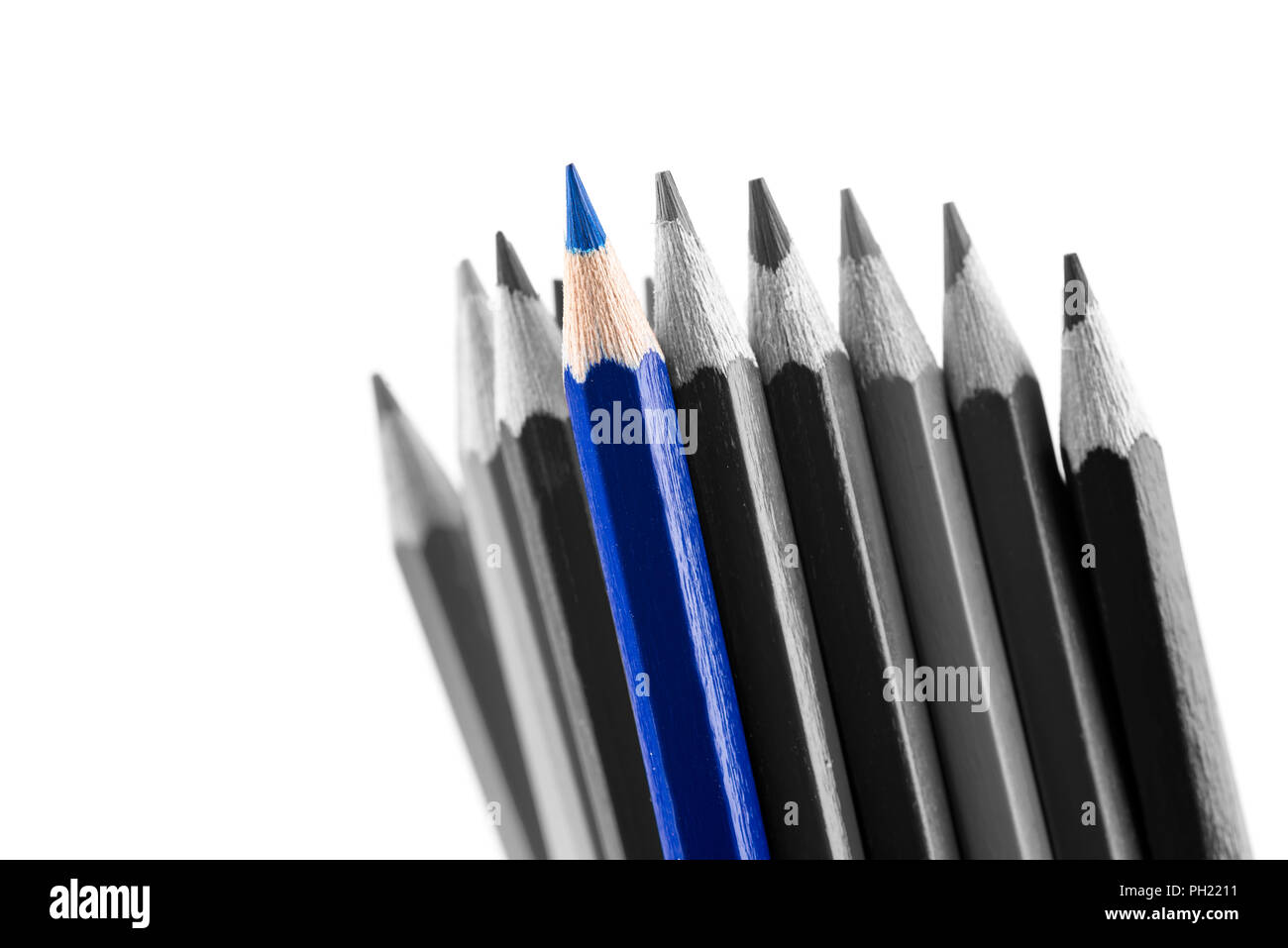 Pile of sharp colored pencils, with different hues, from black to light ...