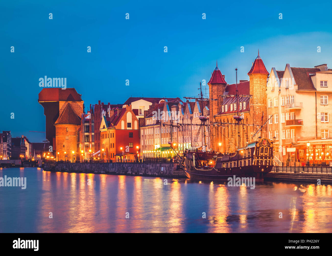 Motlawa river and old Gdansk at night Stock Photo - Alamy