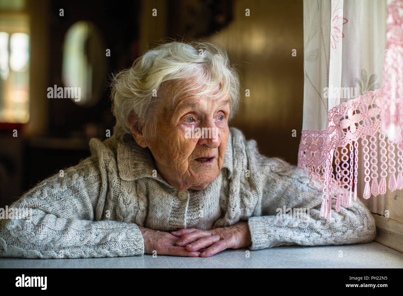 Grandma Looking Out Window High Resolution Stock Photography and Images ...